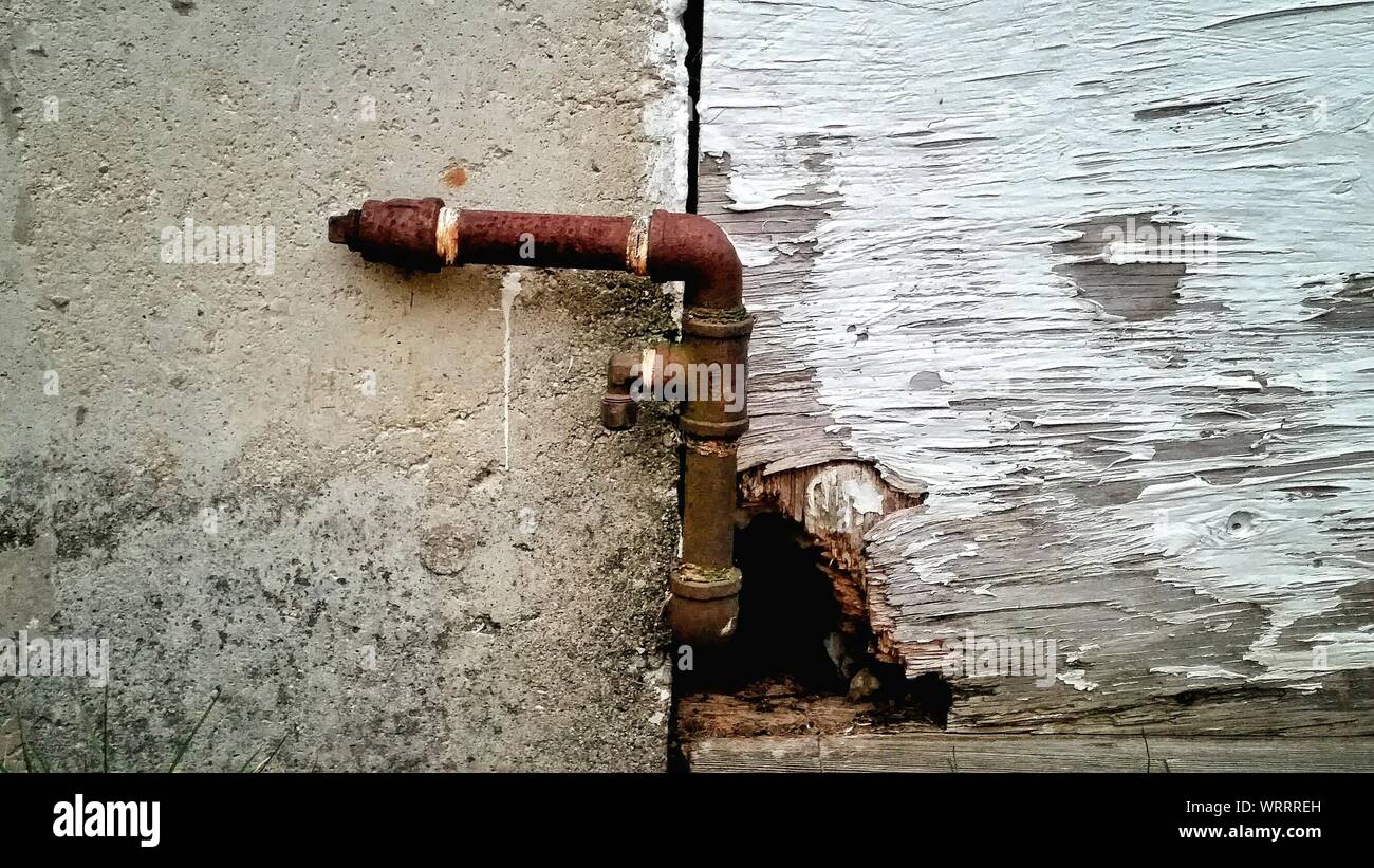 Rusty Pipe On Wall Stock Photo - Alamy