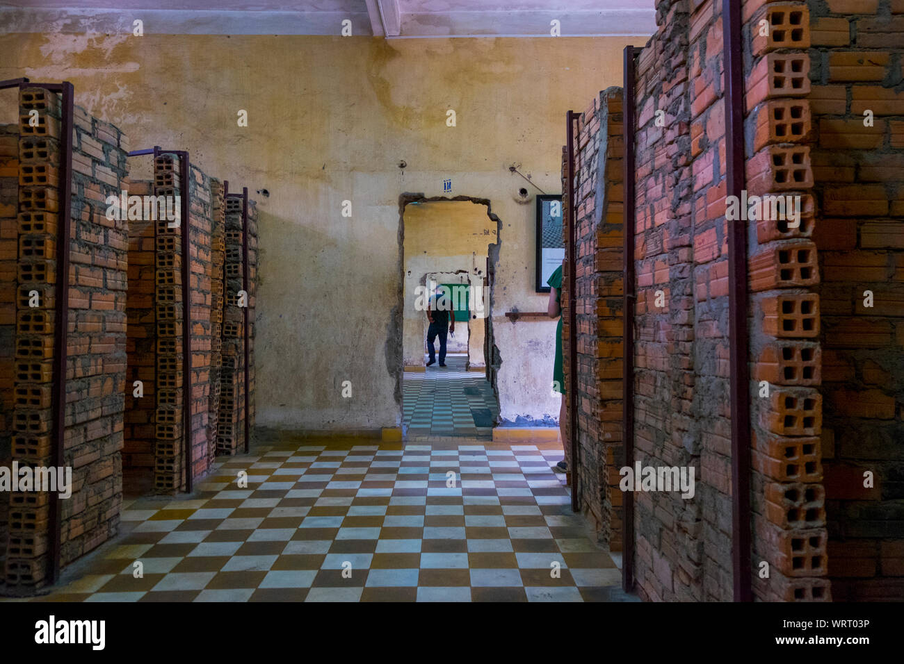 Tiny, solitary cells made of brick in a former classroom at Security ...