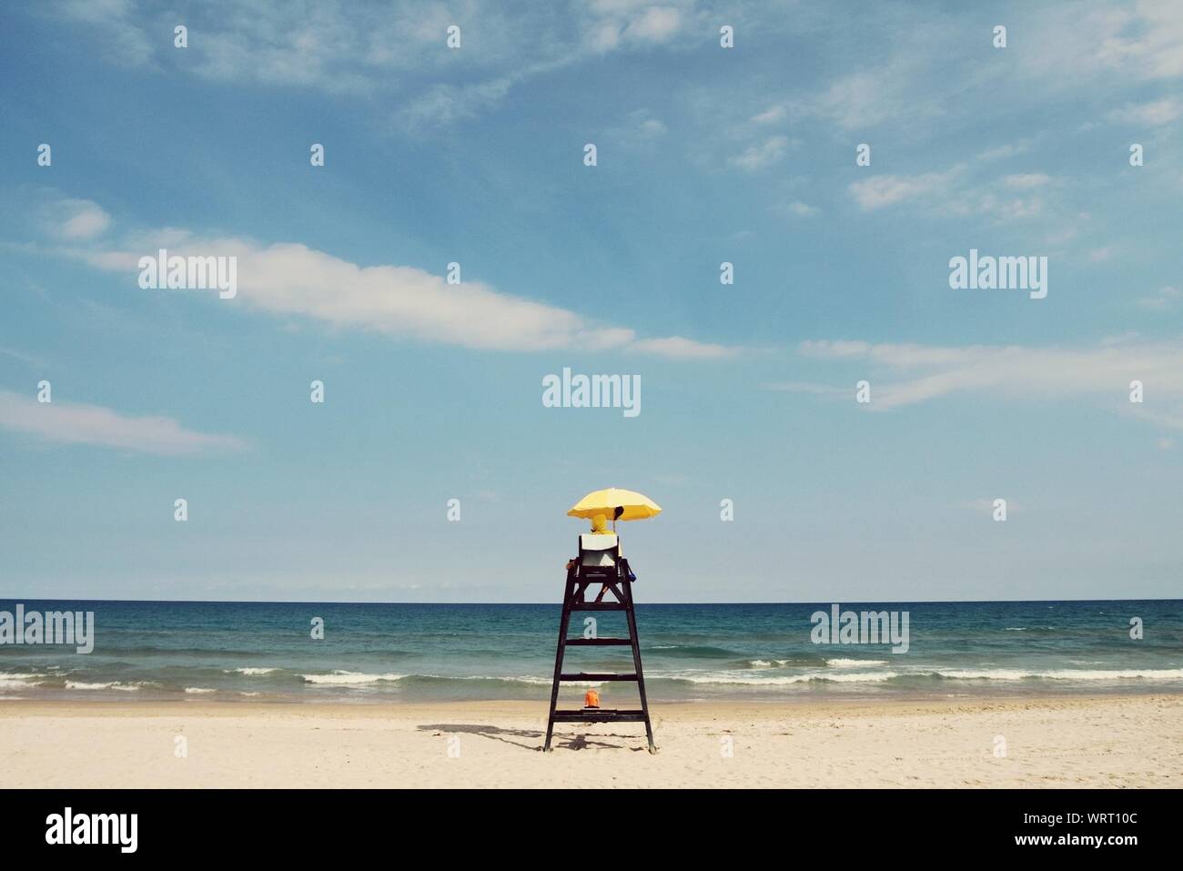 Lifeguard sitting on lifeguard chair hi-res stock photography and ...