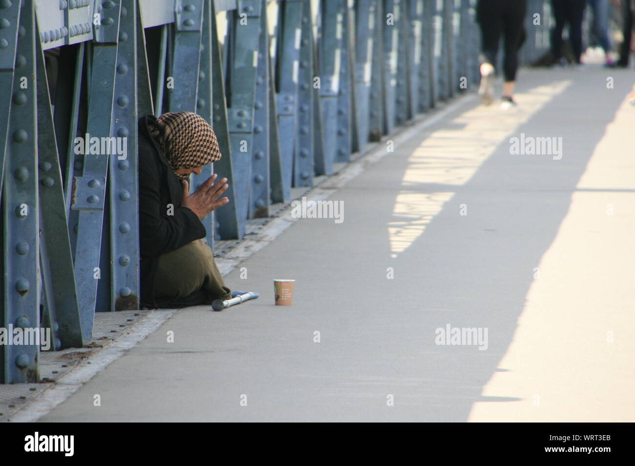 Begging cup hi-res stock photography and images - Alamy