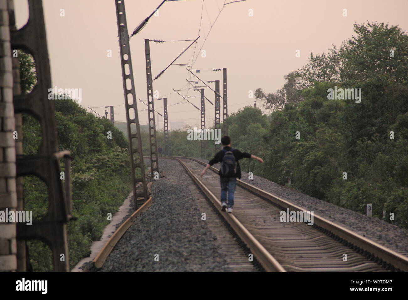 Boy on railroad track hi-res stock photography and images - Alamy