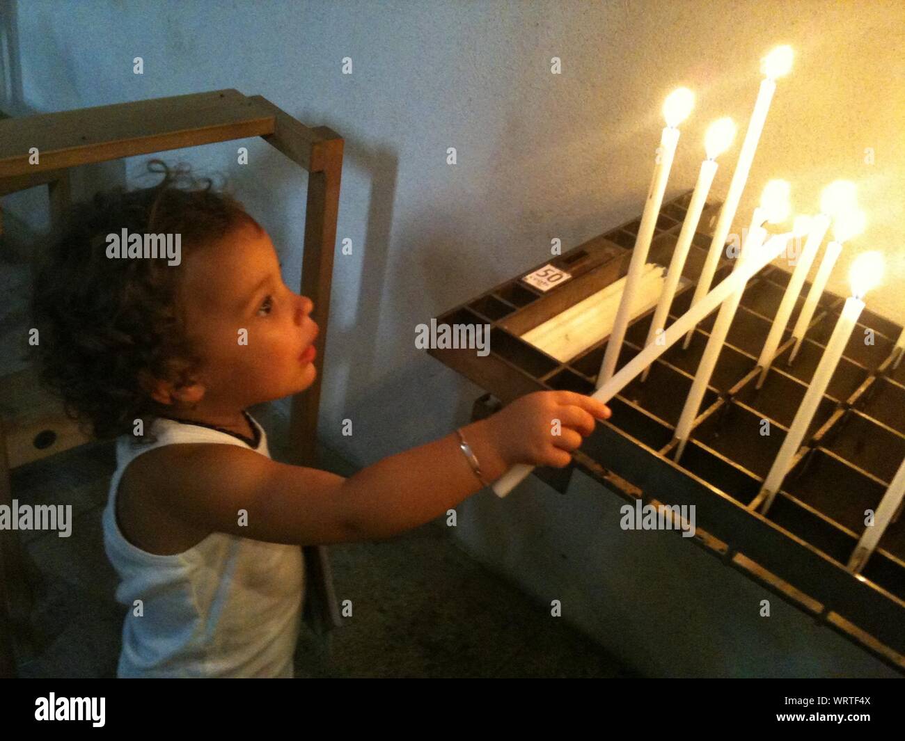 Child with candle church hi-res stock photography and images - Alamy
