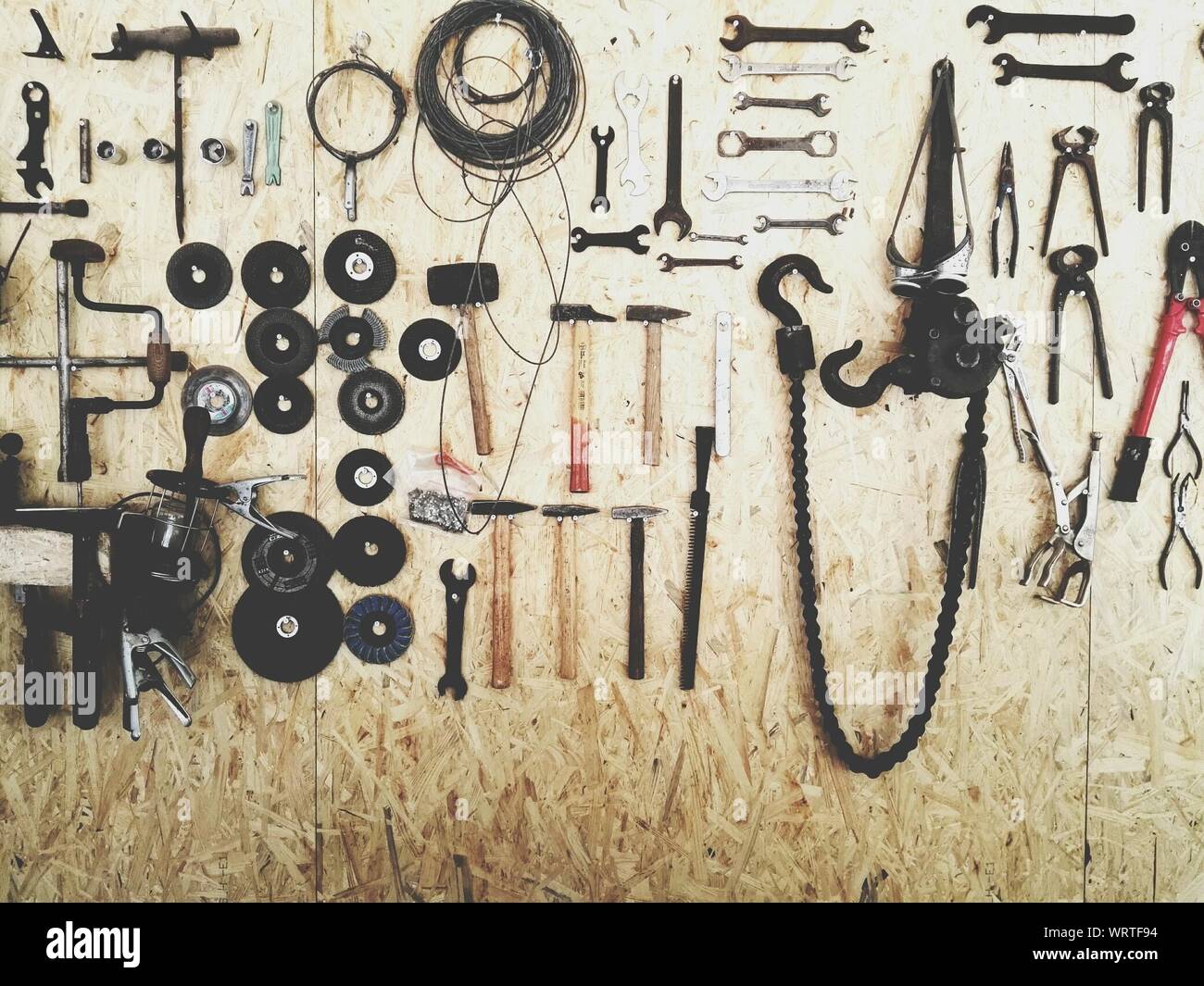 Old tools hanging on wall hi-res stock photography and images - Alamy