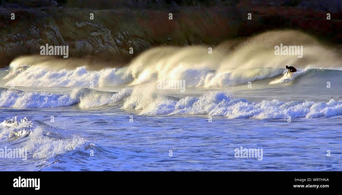 Riding the wave waves hi-res stock photography and images - Alamy