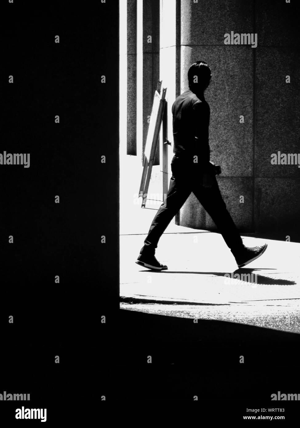 Man Walking Side View Sunlight Black and White Stock Photos & Images ...