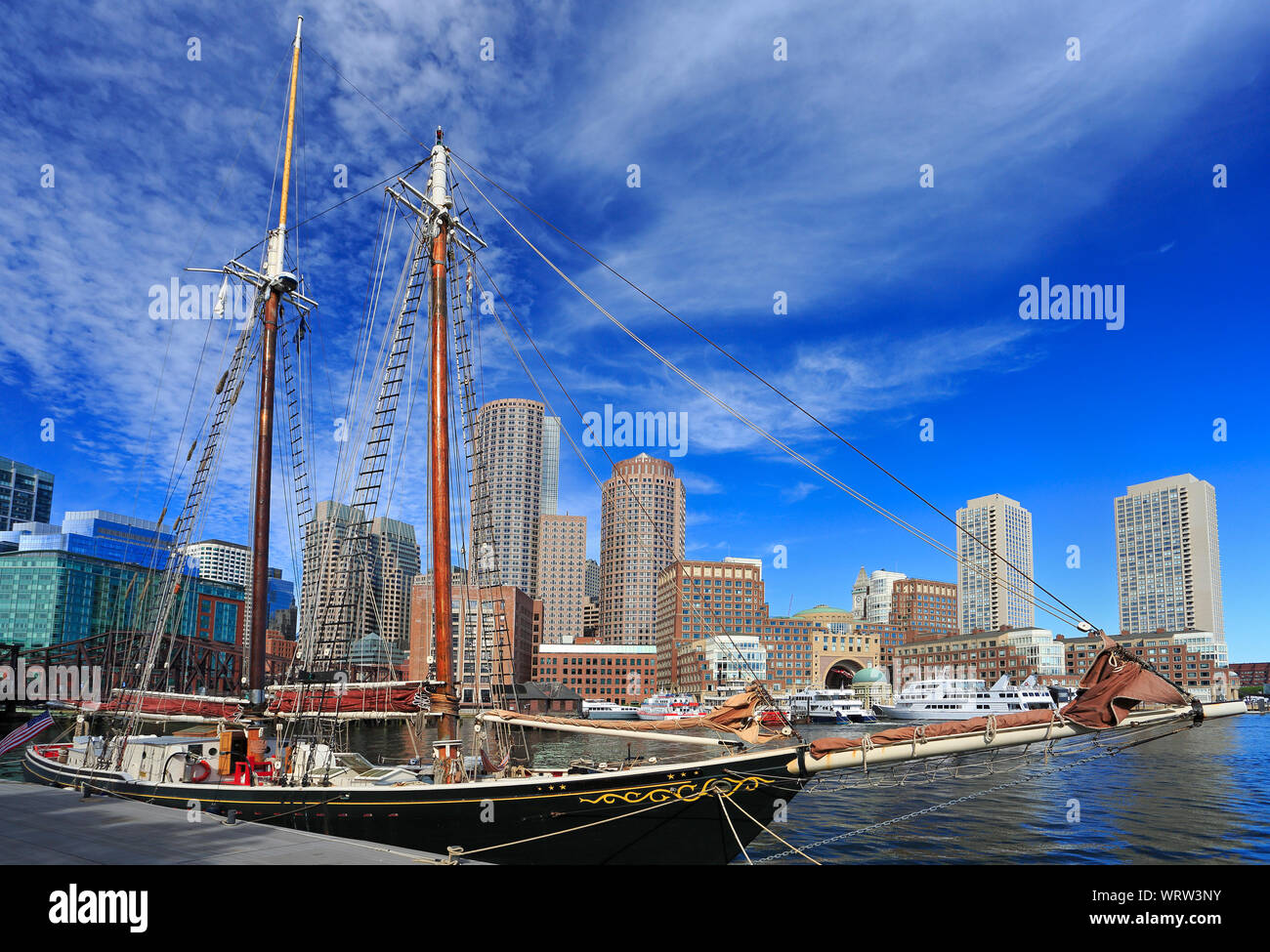 Boston skyline with skyscrapers reflections into the ocean and rusty ...