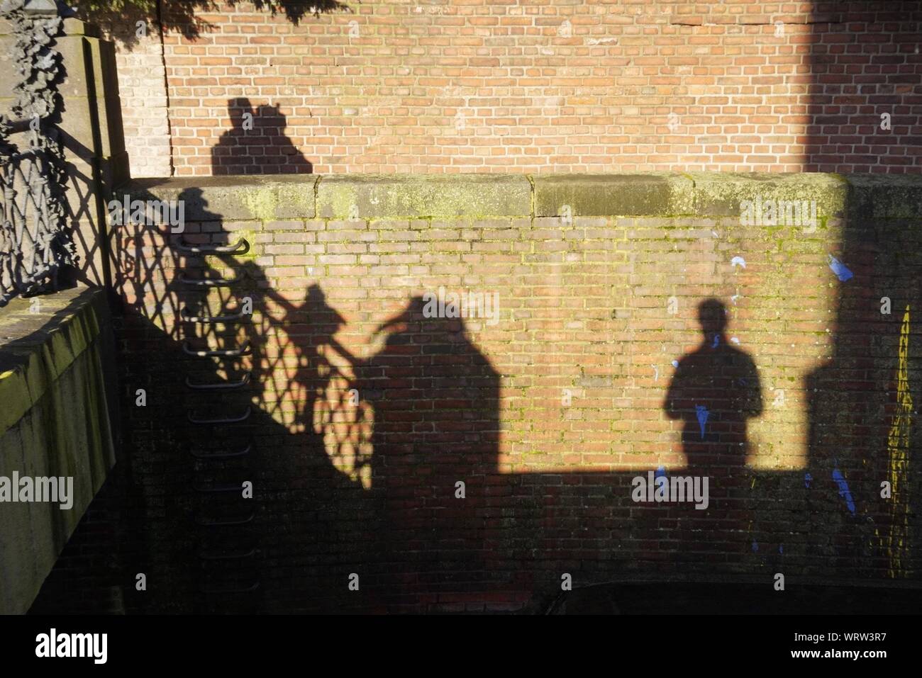 Shadow Of Person On Wall Of Building Stock Photo - Alamy