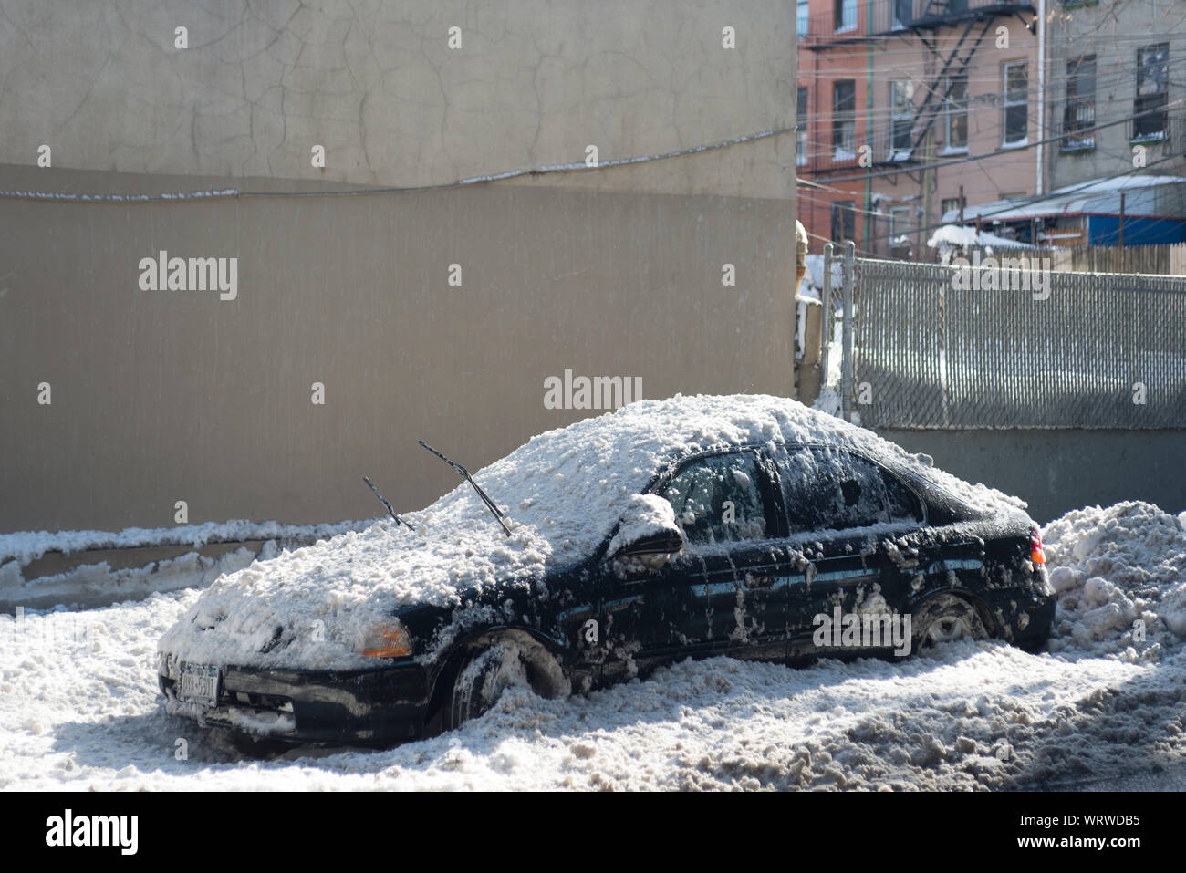 Car in deep snow in Brooklyn, New York Stock Photo - Alamy