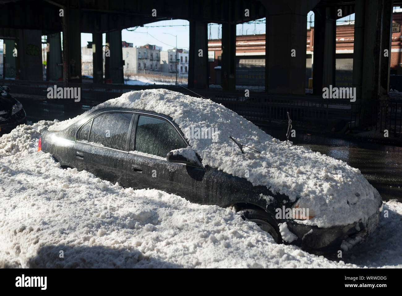 Car in deep snow in Brooklyn, New York Stock Photo - Alamy