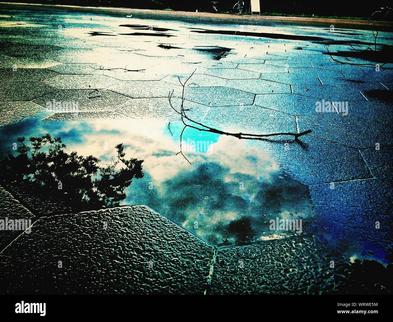 Pavement puddle hi-res stock photography and images - Alamy