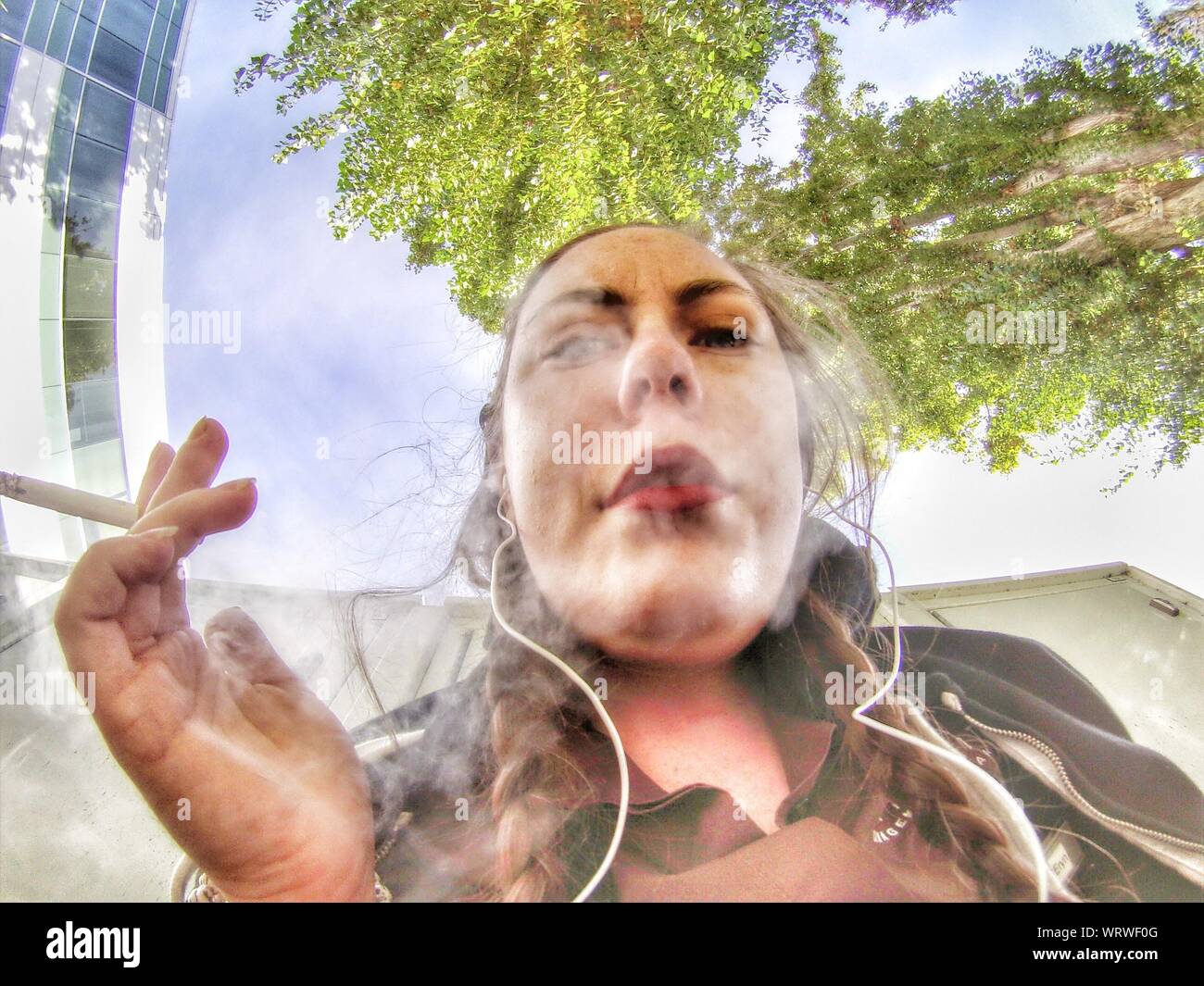 Woman smoking in tree hi-res stock photography and images - Alamy