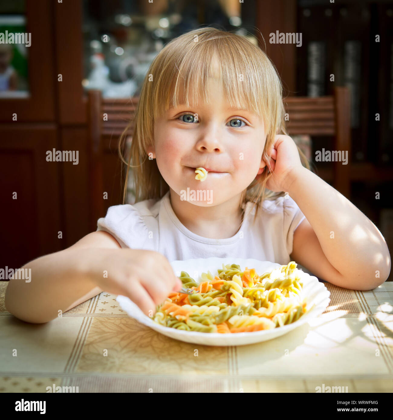 Child eating pasta hi-res stock photography and images - Alamy