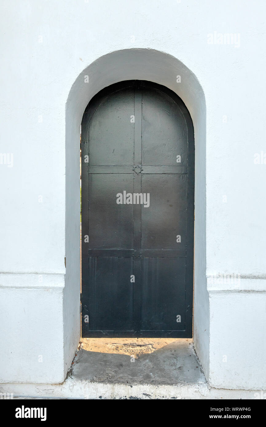 black are the doors of the temple. arched vault. closed door Orthodox ...