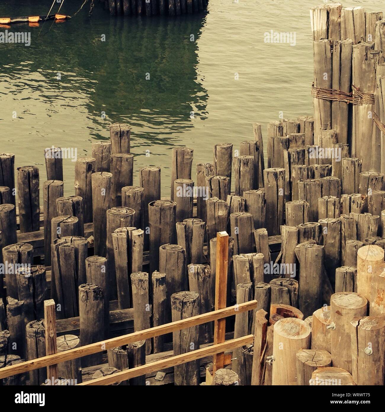 Wooden poles in water hi-res stock photography and images - Alamy
