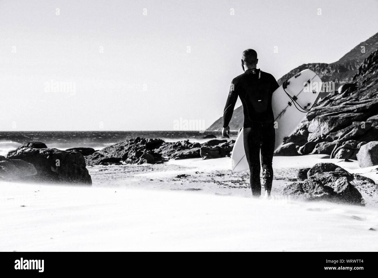 Carrying her surfboard hi-res stock photography and images - Alamy