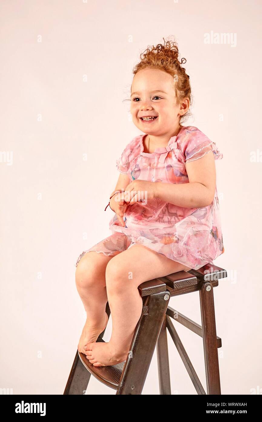 Child Sitting Stool High Resolution Stock Photography and Images - Alamy