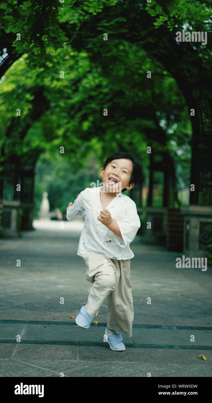 Asian boys running hi-res stock photography and images - Alamy