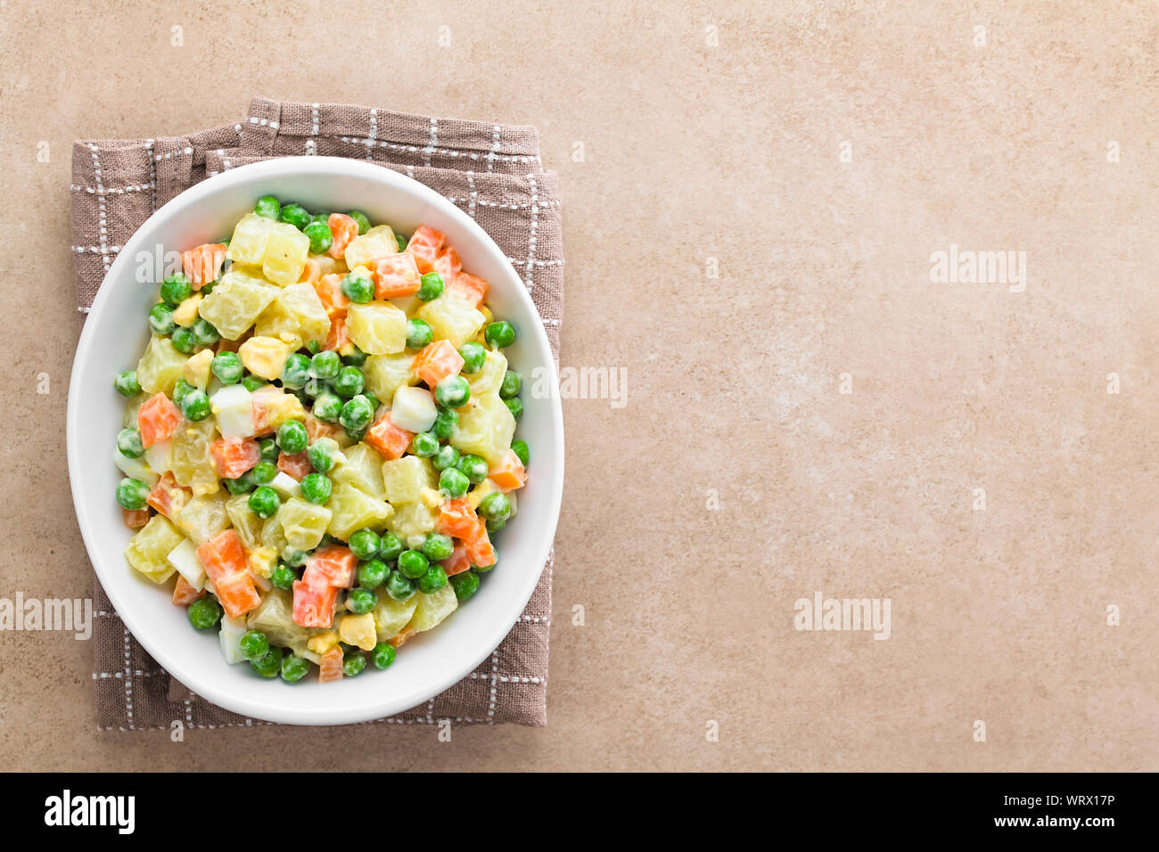 Fresh homemade vegetarian Russian or Olivier salad made of potato ...