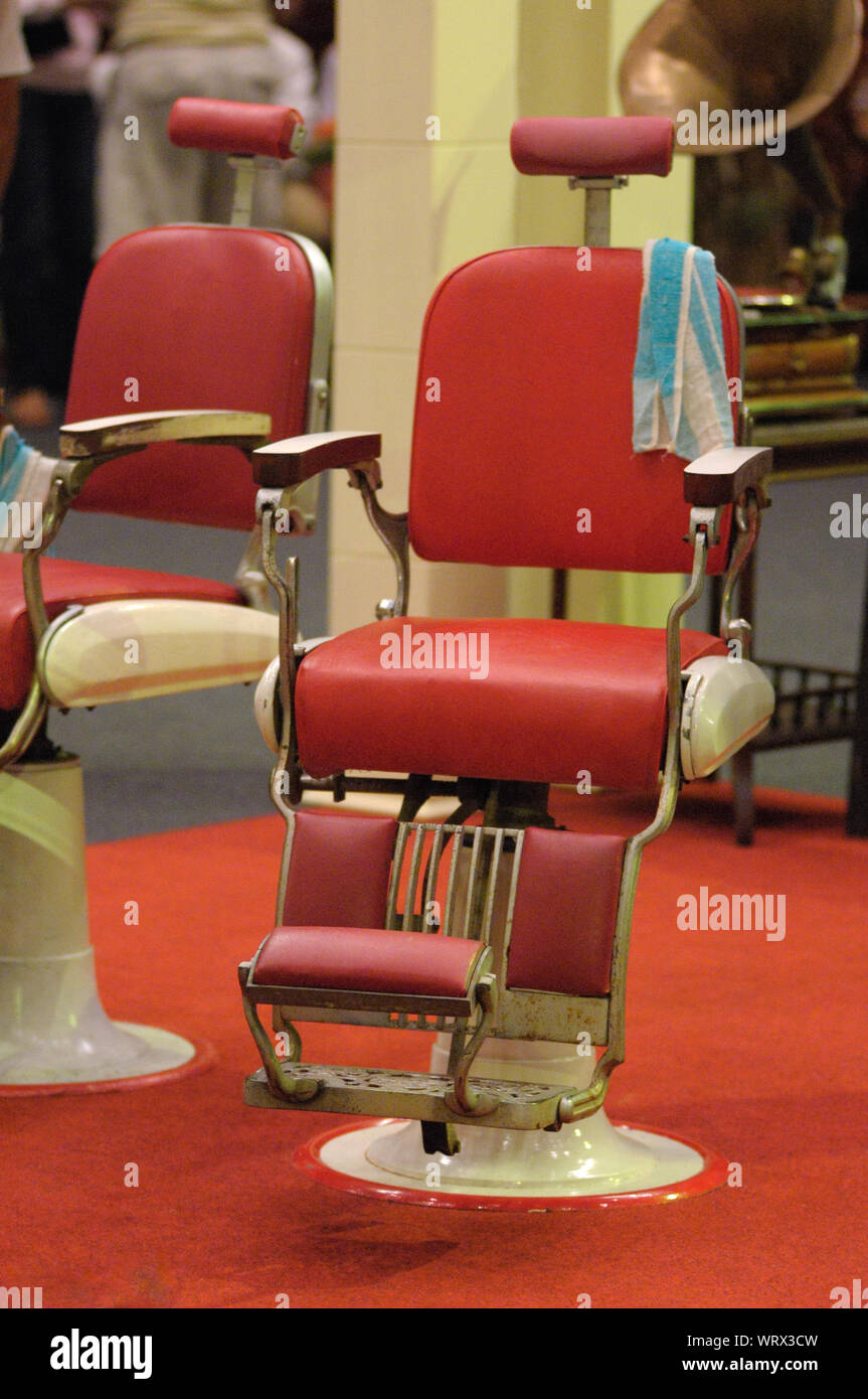 Two sitting on one chair hi-res stock photography and images - Alamy