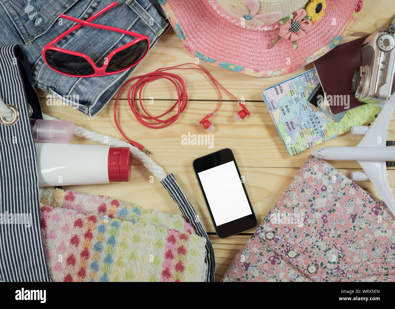 Travel concept with female personal accessory and costumes on wooden ...