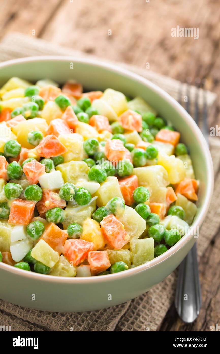 Fresh homemade vegetarian Russian or Olivier salad made of potato ...