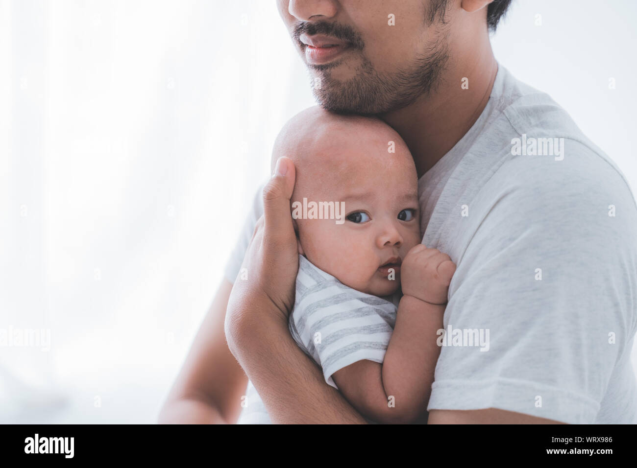 father carry his baby boy playing together at home Stock Photo - Alamy