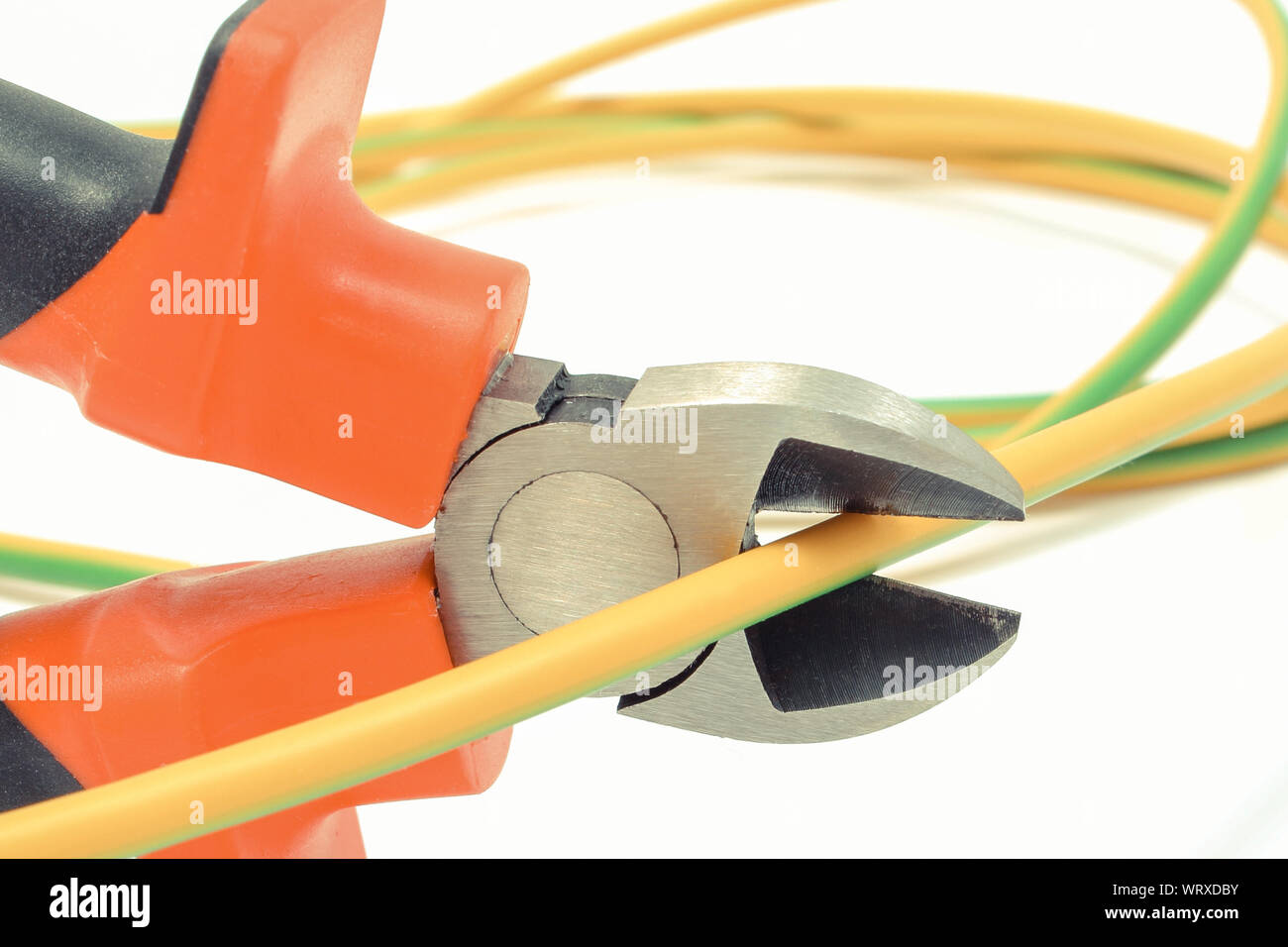 Metal pliers with electric cable on white background. Technology ...