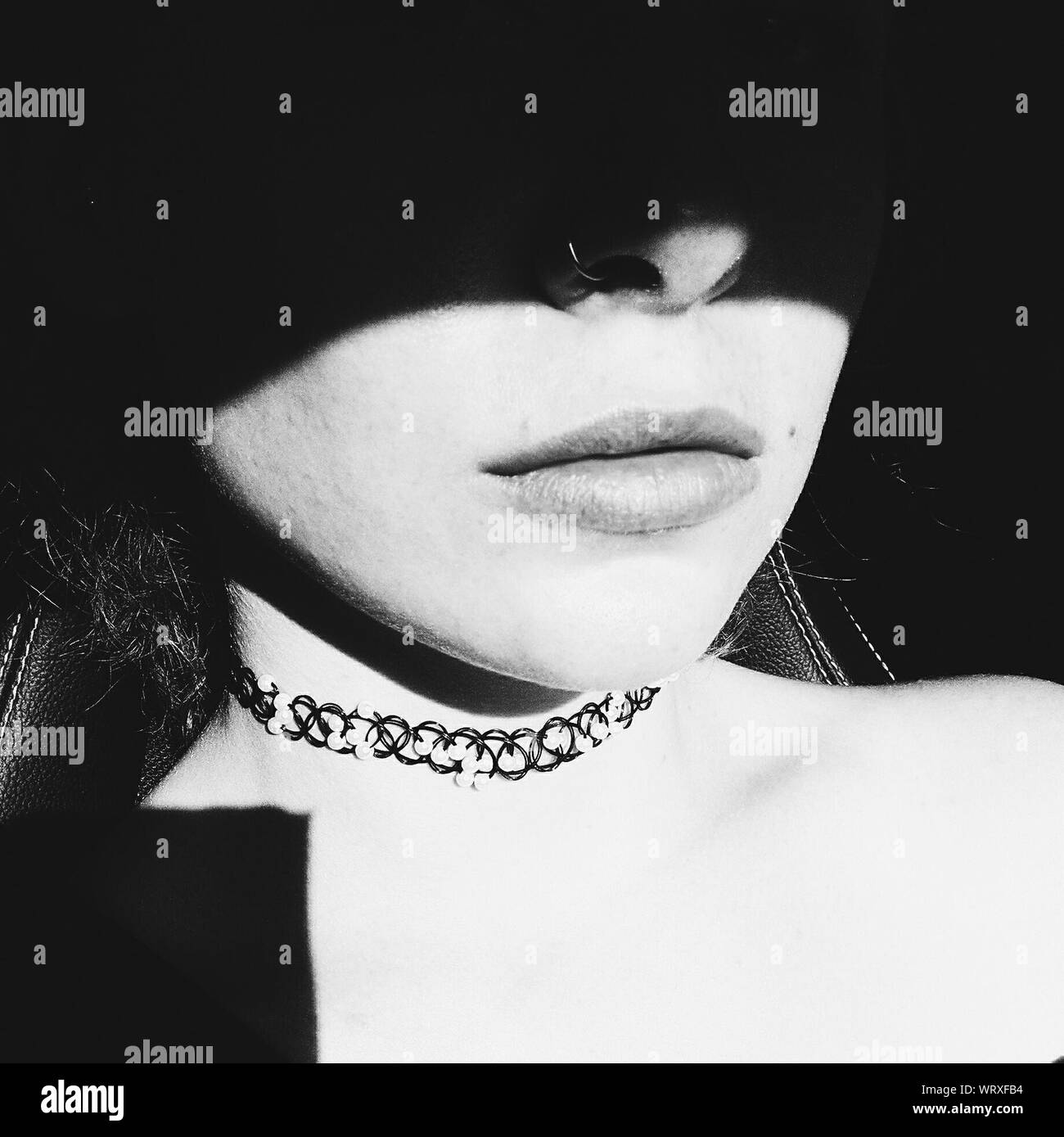 Young woman wearing choker hi-res stock photography and images - Alamy