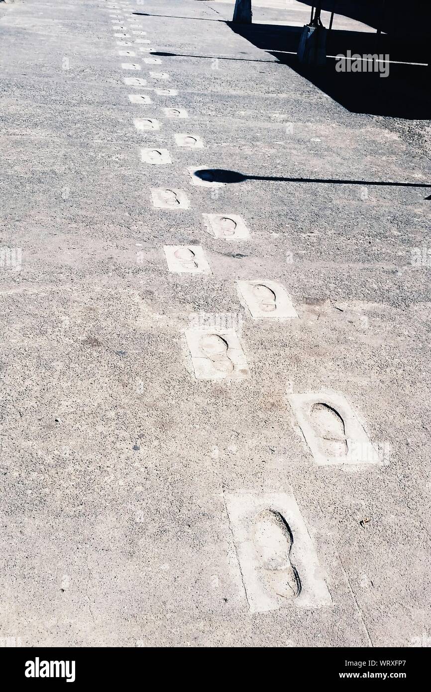 Footprints In Concrete Stock Photo - Alamy