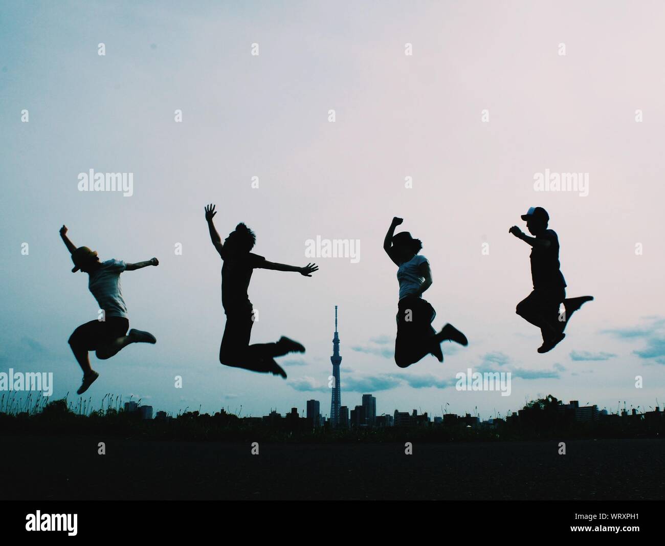 Happy women jumping hi-res stock photography and images - Alamy