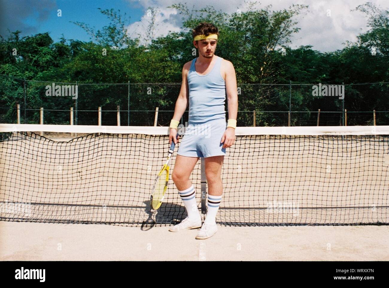 Young man tennis racket hi-res stock photography and images - Alamy