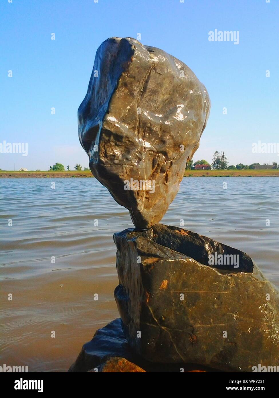 Lone rock in water hi-res stock photography and images - Alamy