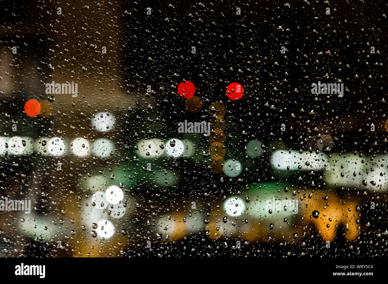 City through rainy window at night hi-res stock photography and images ...