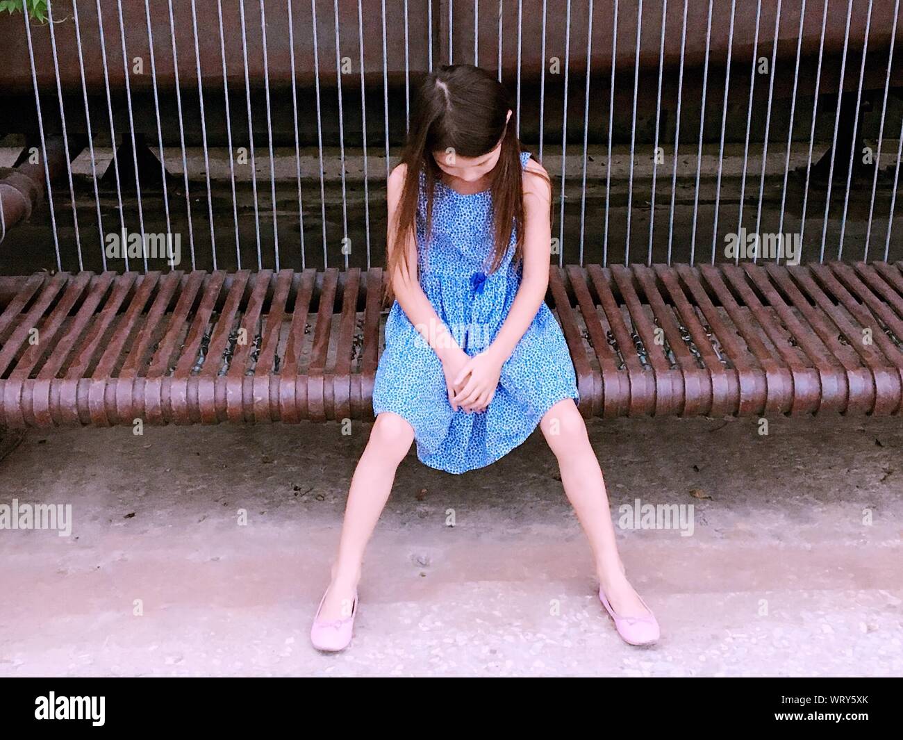 Sad girl sitting hi-res stock photography and images - Alamy