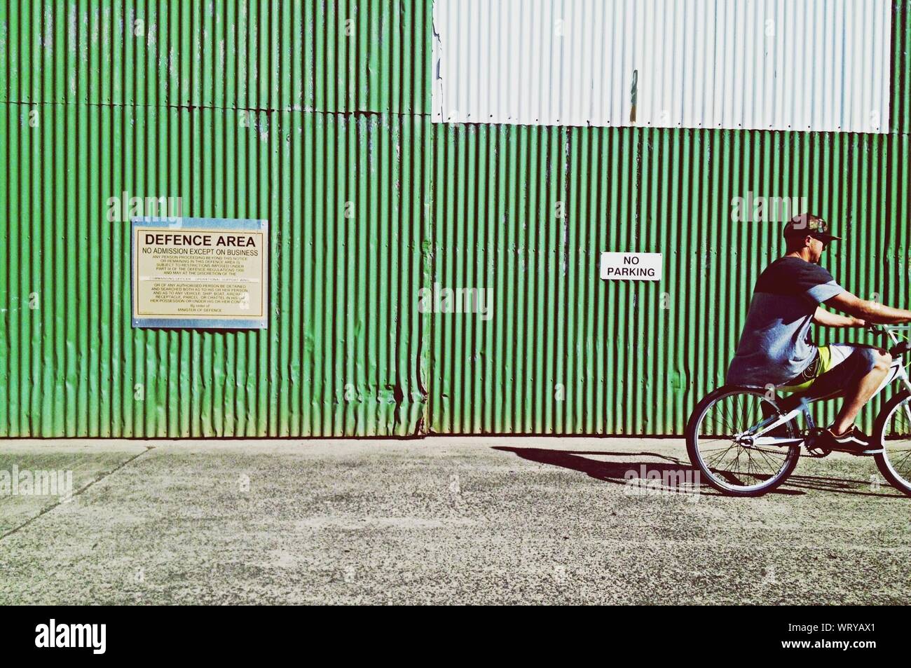 Riding bicycle side view full length hi-res stock photography and ...