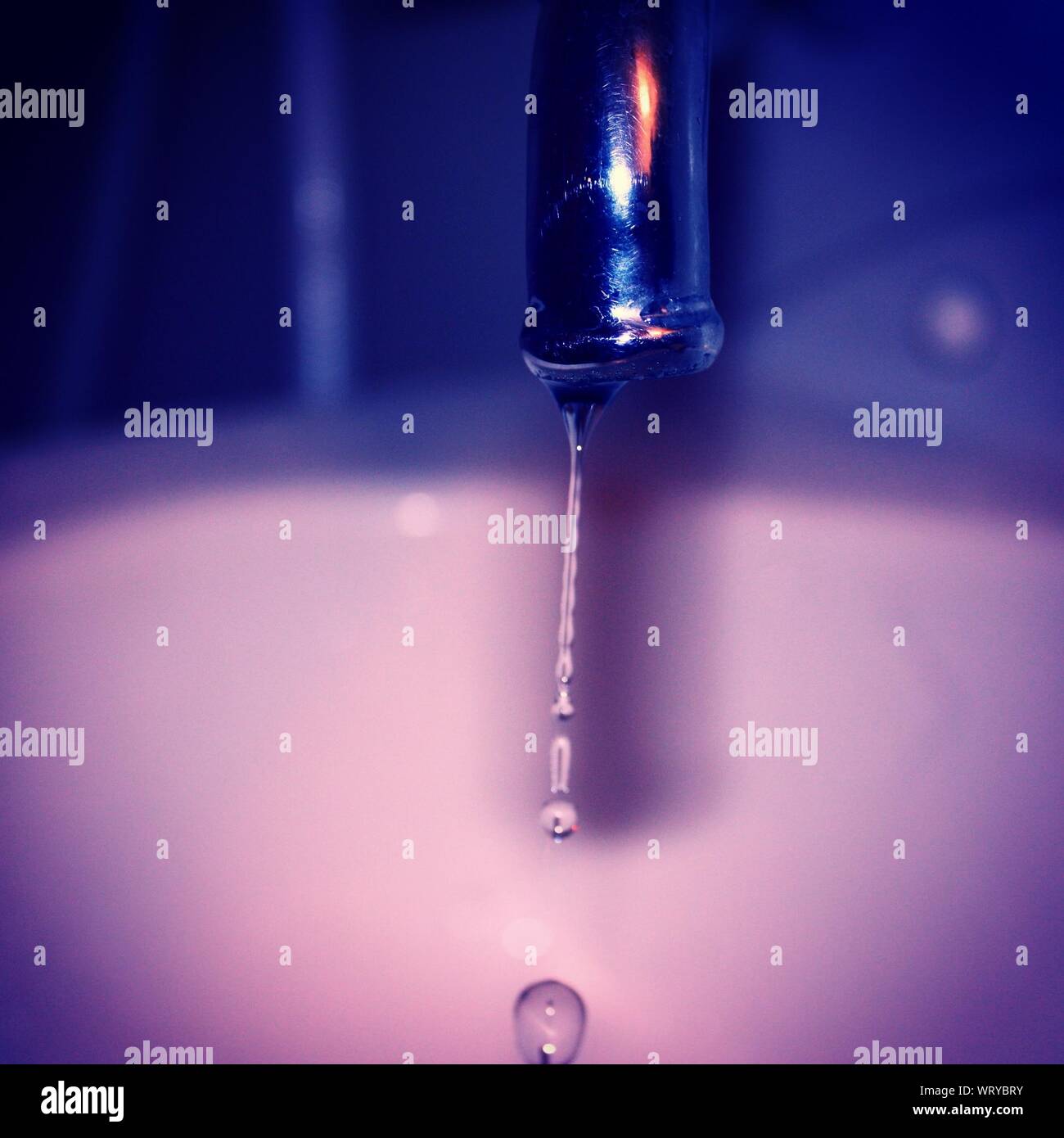 Close up of water dripping from faucet hi-res stock photography and ...
