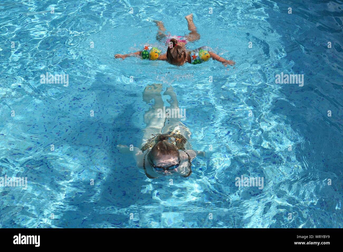 Teenage friends in swimming pool hi-res stock photography and images ...