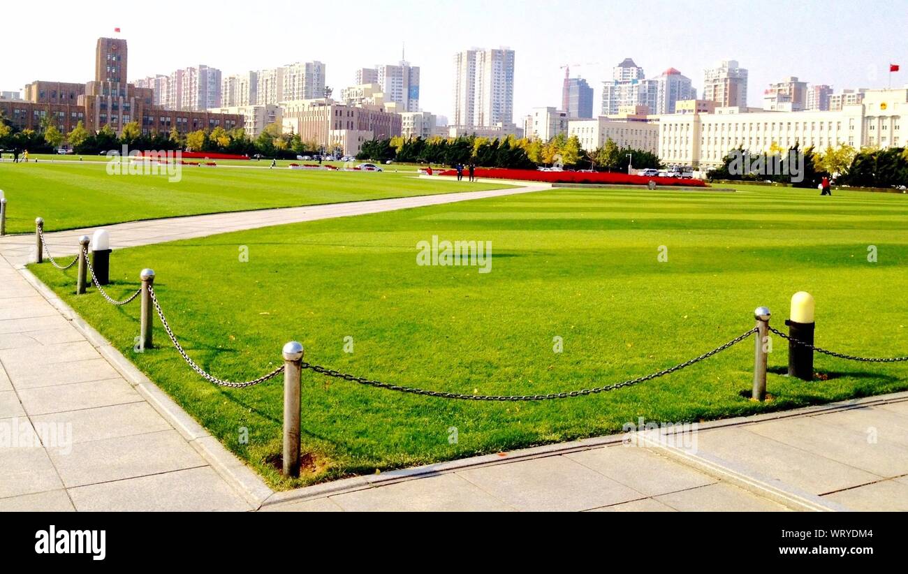 Park With City Buildings In Background Stock Photo - Alamy