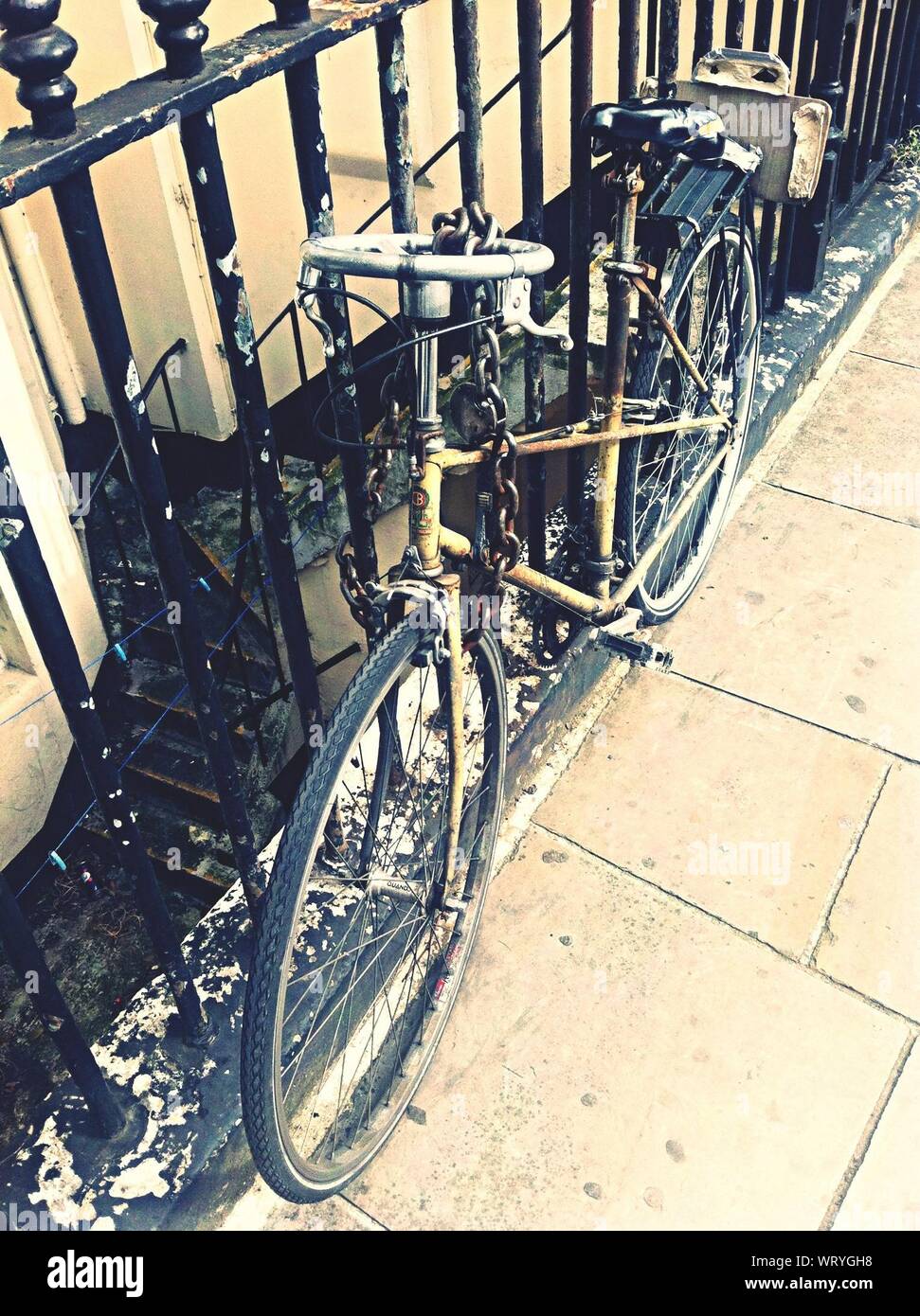 Bicycle chained railing hi-res stock photography and images - Alamy