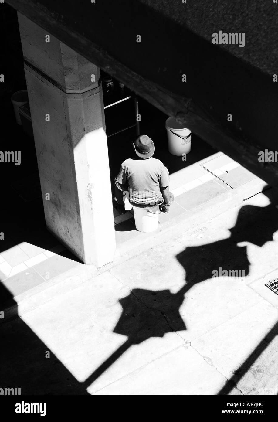 Man Sitting On Bucket High Resolution Stock Photography and Images - Alamy