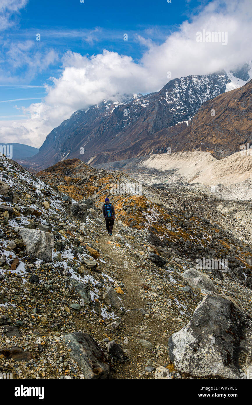 A trekker with backpack on the trekking route to Gochela pass in the ...