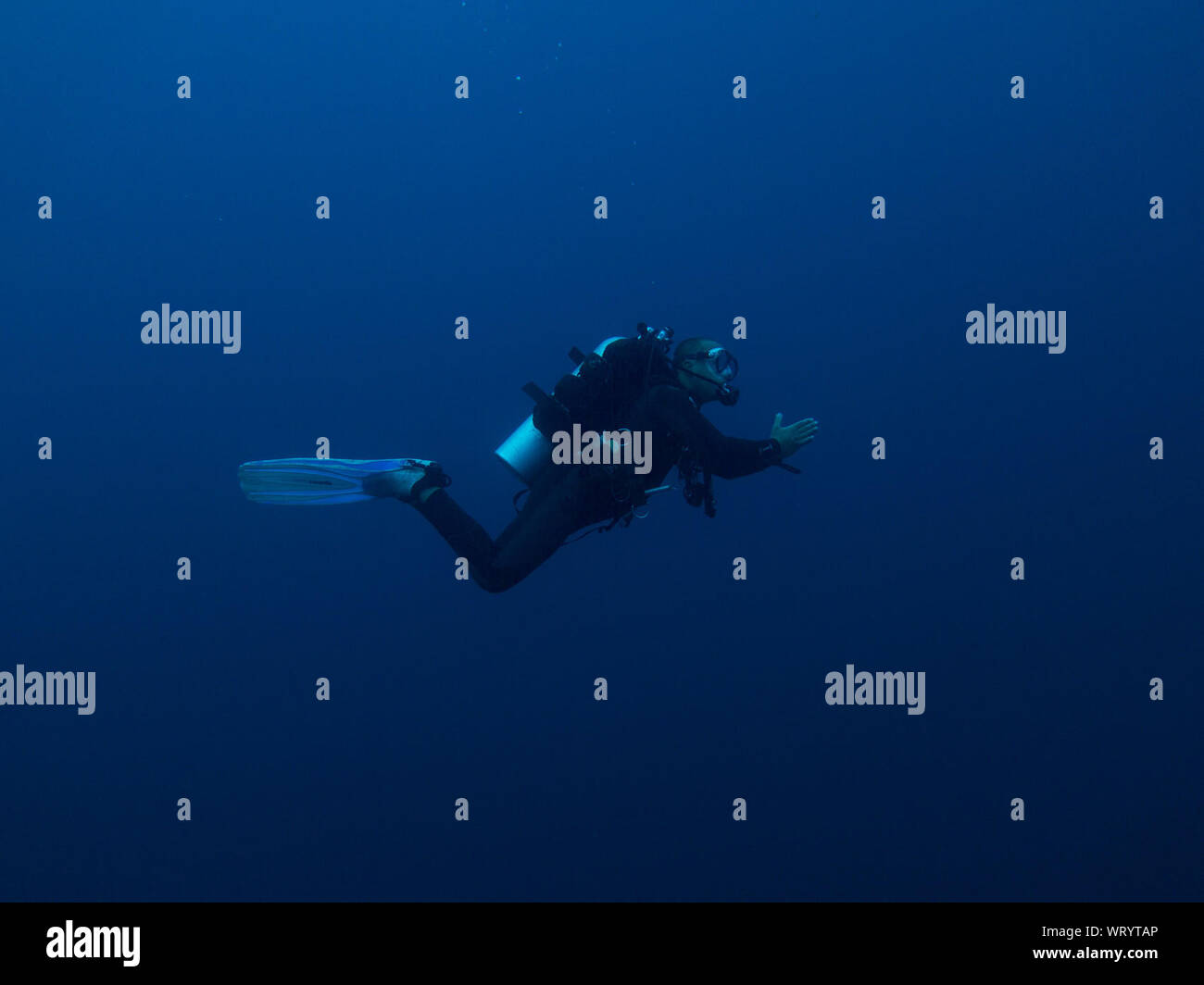 Full Length Side View Of Man Scuba Diving In Sea Stock Photo - Alamy