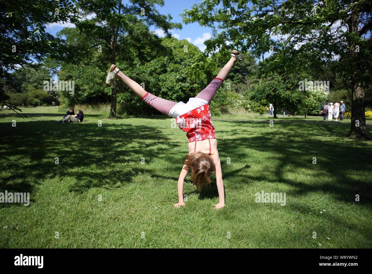 Girl doing handstand hi-res stock photography and images - Alamy