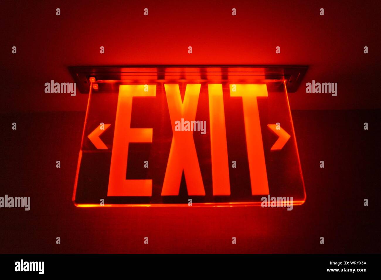 Close Up View Of Illuminated Exit Sign Stock Photo - Alamy