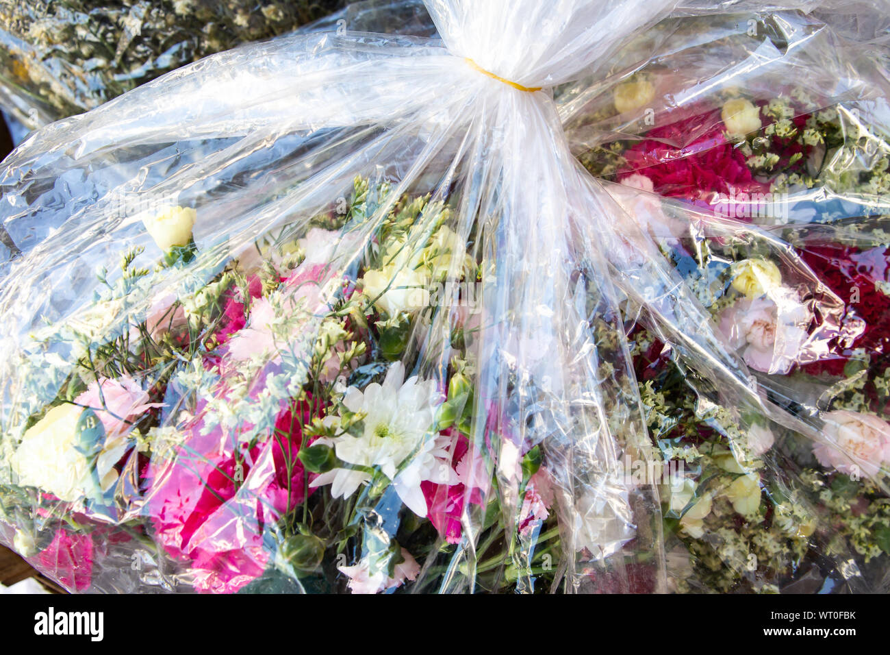 Bouquet flowers in trash hi-res stock photography and images - Alamy