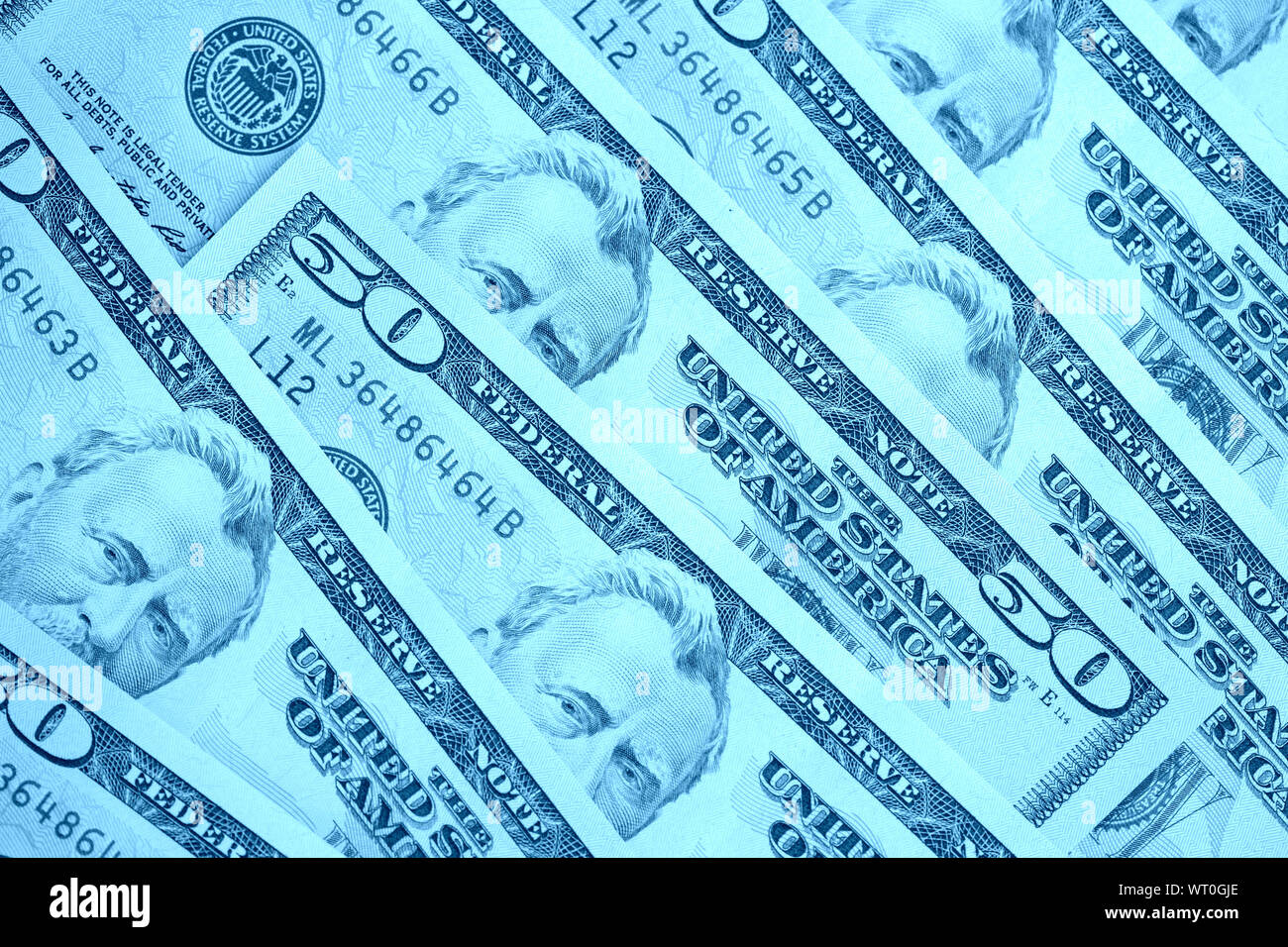 USD fifty dollar bills close up. Money background blue color toned ...