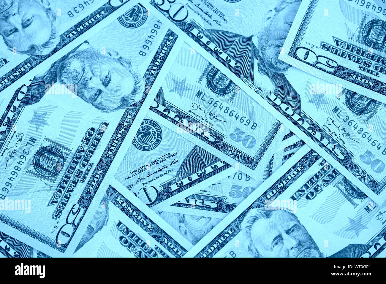 USD fifty dollar bills close up. Money background blue color toned ...