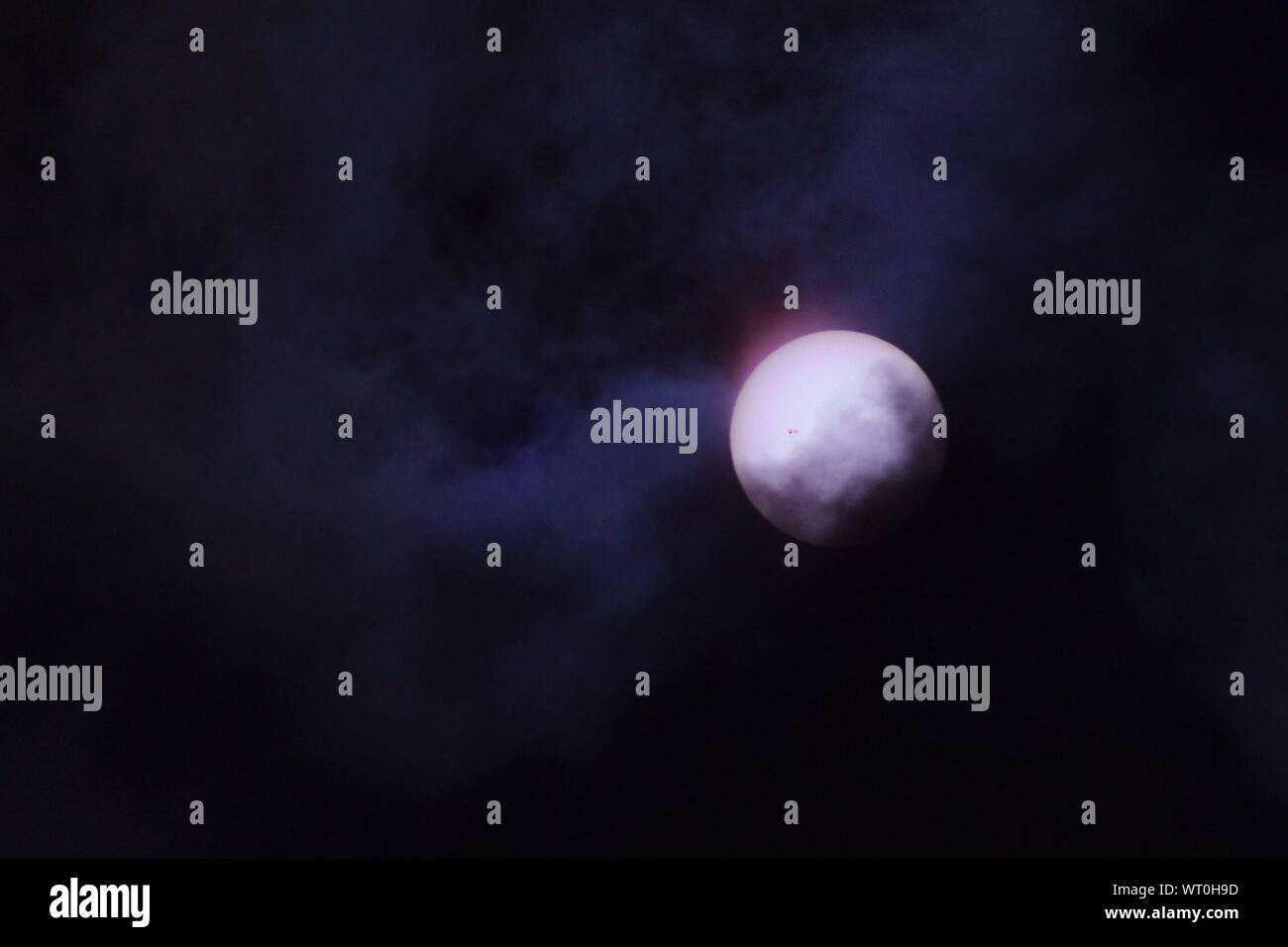 Moon covered in clouds hi-res stock photography and images - Alamy