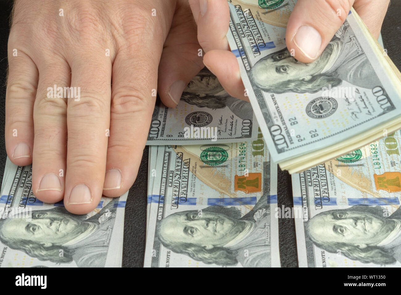 Businessman hands counting dollar banknotes hi-res stock photography ...