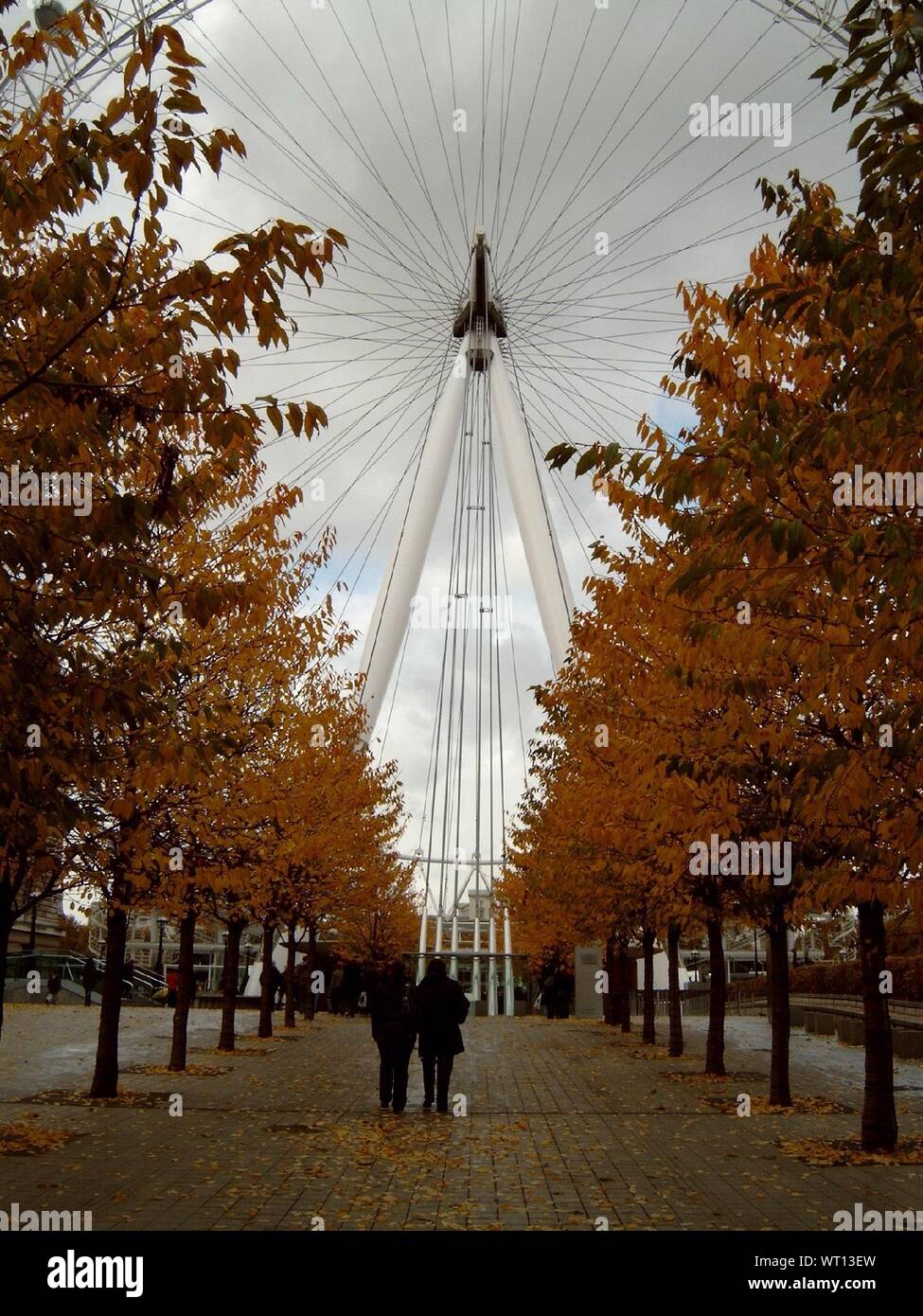 View Of Tall Tower And Tourist At Park Stock Photo - Alamy
